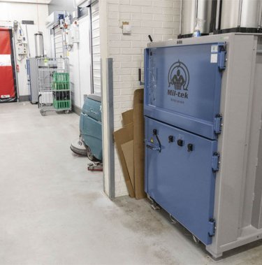 How does a cardboard baler work?
