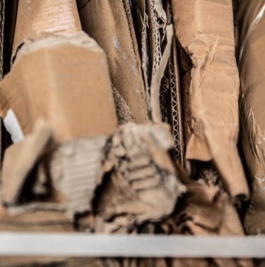How do you prepare cardboard for recycling?